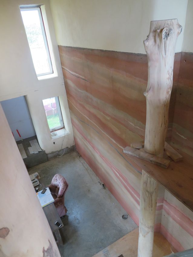 Rammed Earth Feature Walls in Net Zero Home - Ecohome