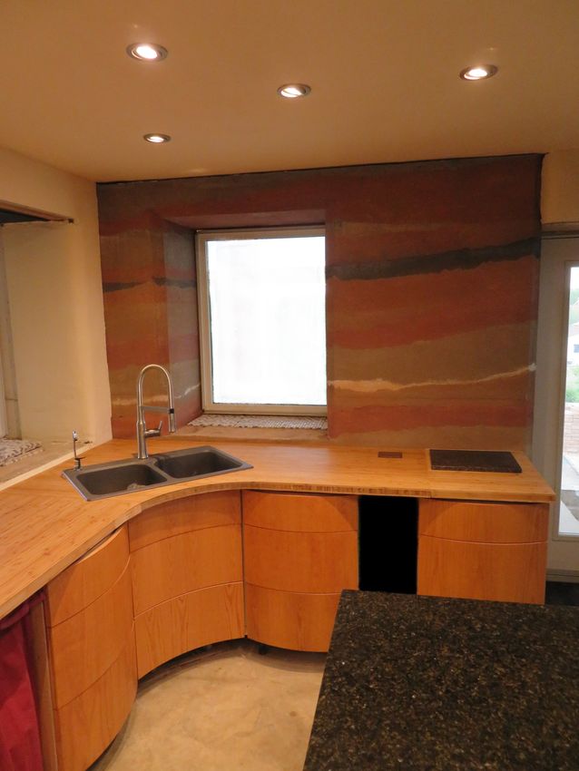Rammed Earth Feature Walls in Net Zero Home - Ecohome