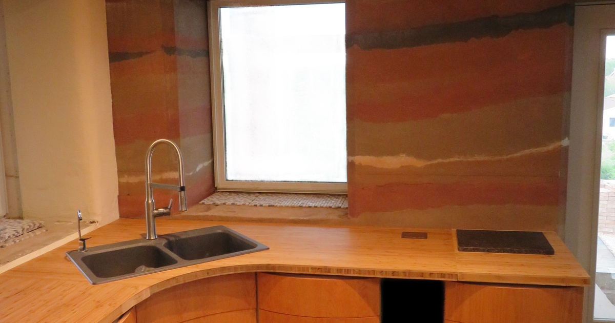 Rammed Earth Feature Walls in Net Zero Home - Ecohome