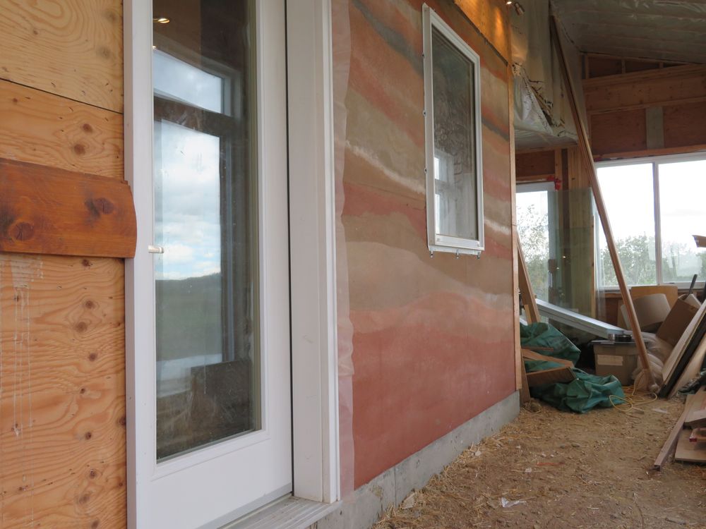 Rammed Earth Feature Walls in Net Zero Home - Ecohome